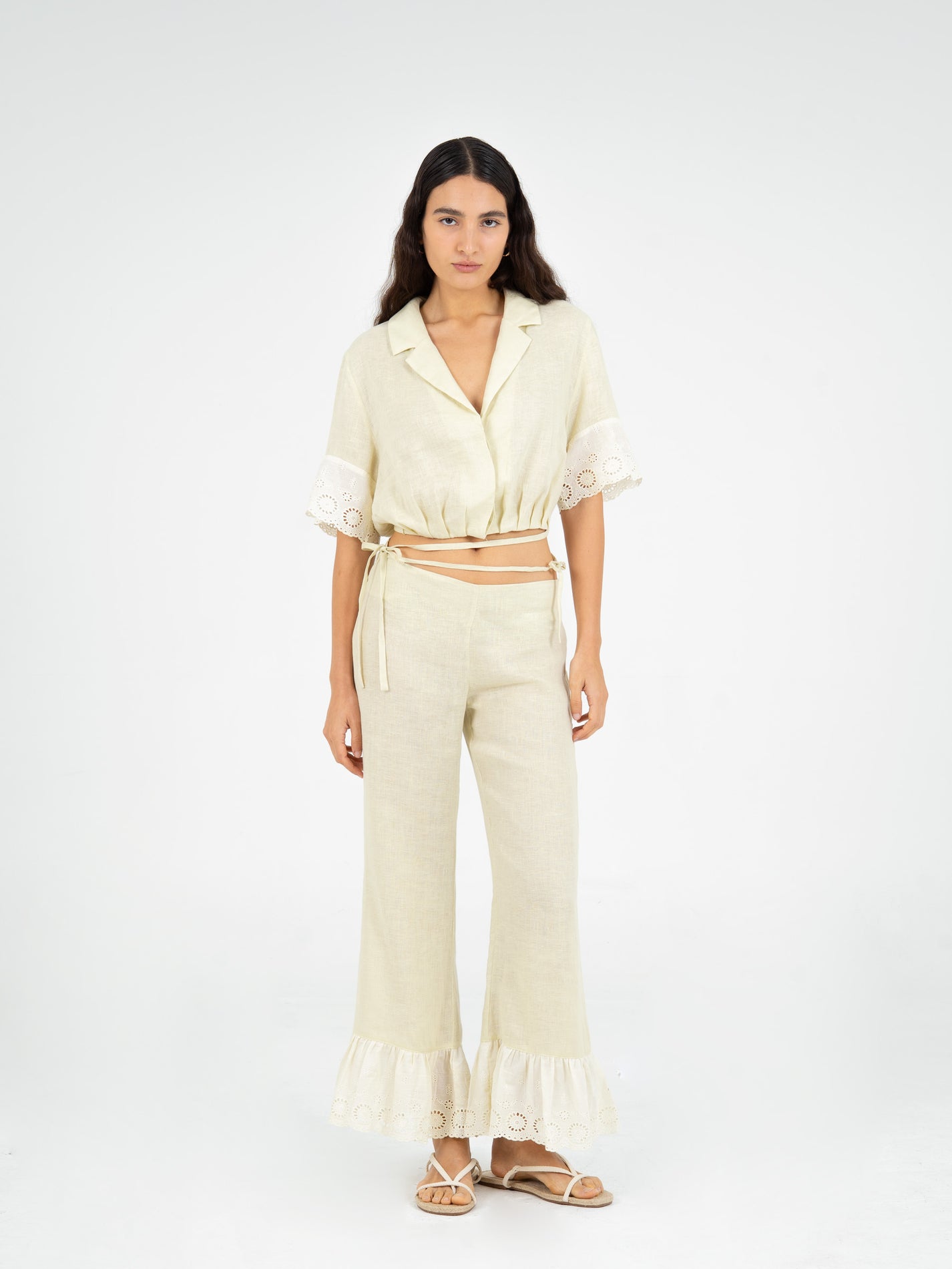 Beige linen pants with embroidered ruffles at the hem | CARMEN SAYS