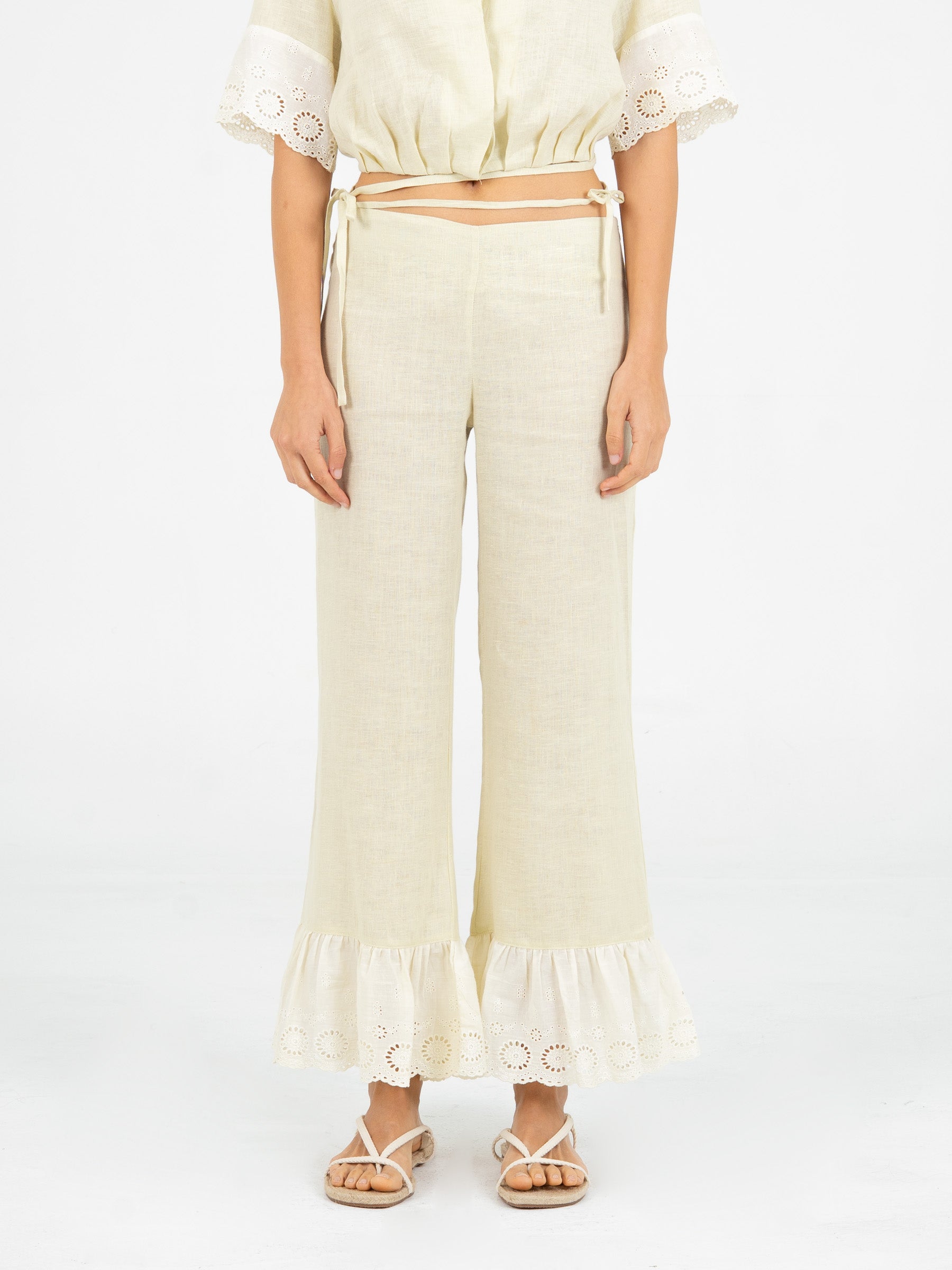 Beige linen pants with embroidered ruffles at the hem | CARMEN SAYS